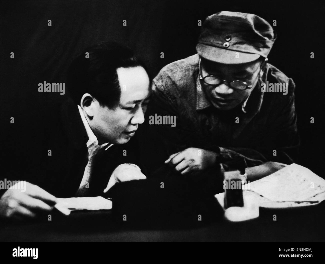 Chairman Mao Zedong and comrade Chu Teh study guidelines for military ...