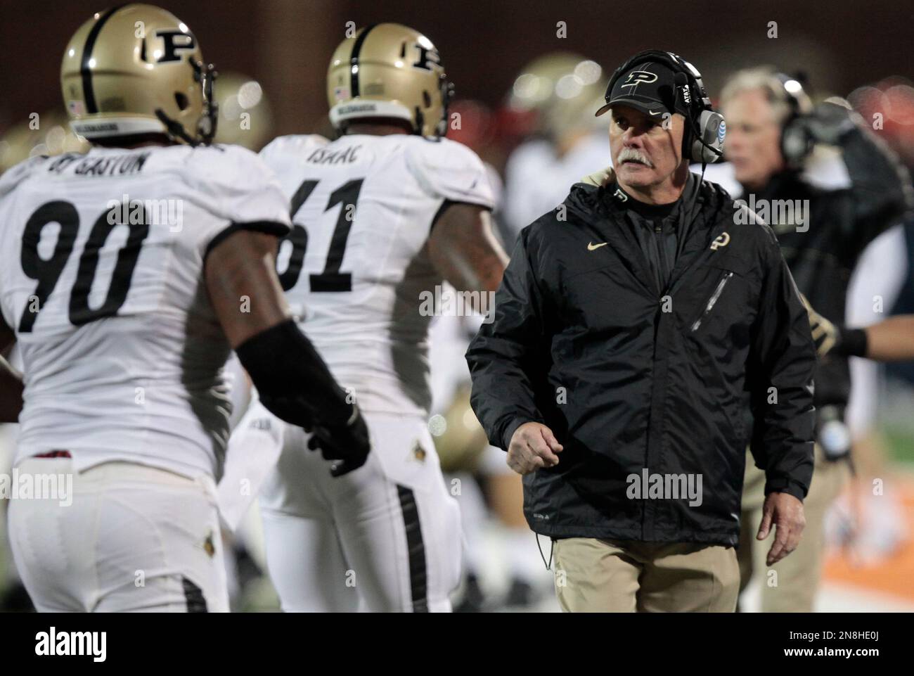 Purdue Head Coach Danny Hope talks to defensive players as they come ...