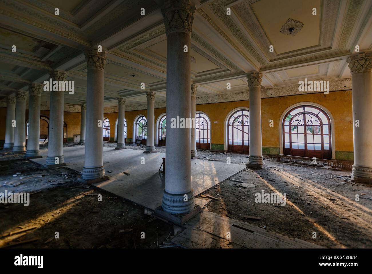 Large hall with columns in old abandoned mansion Stock Photo - Alamy