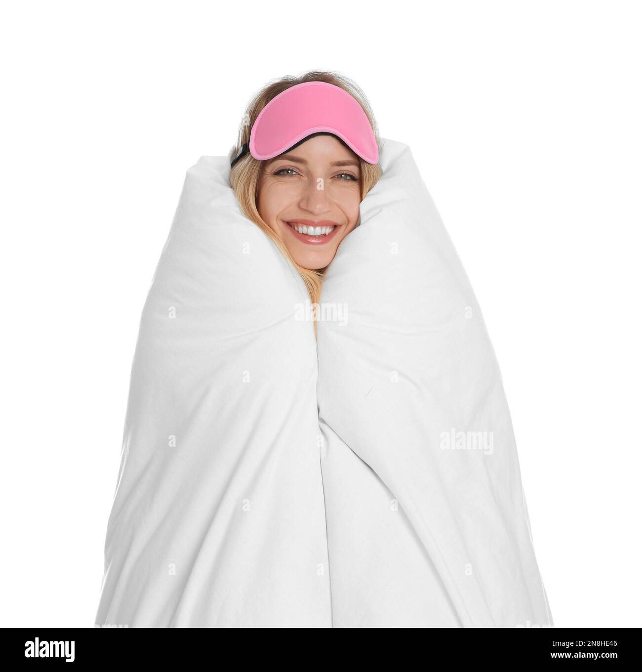 Young woman in sleeping mask wrapped with soft blanket on white ...