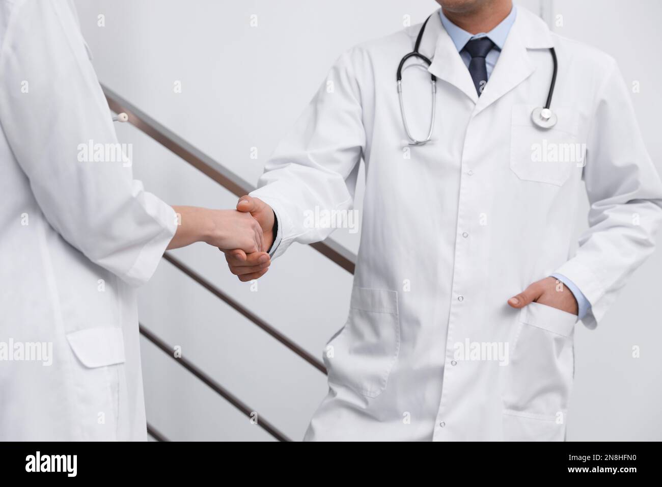 Doctors greeting with handshake in clinic, closeup Stock Photo - Alamy