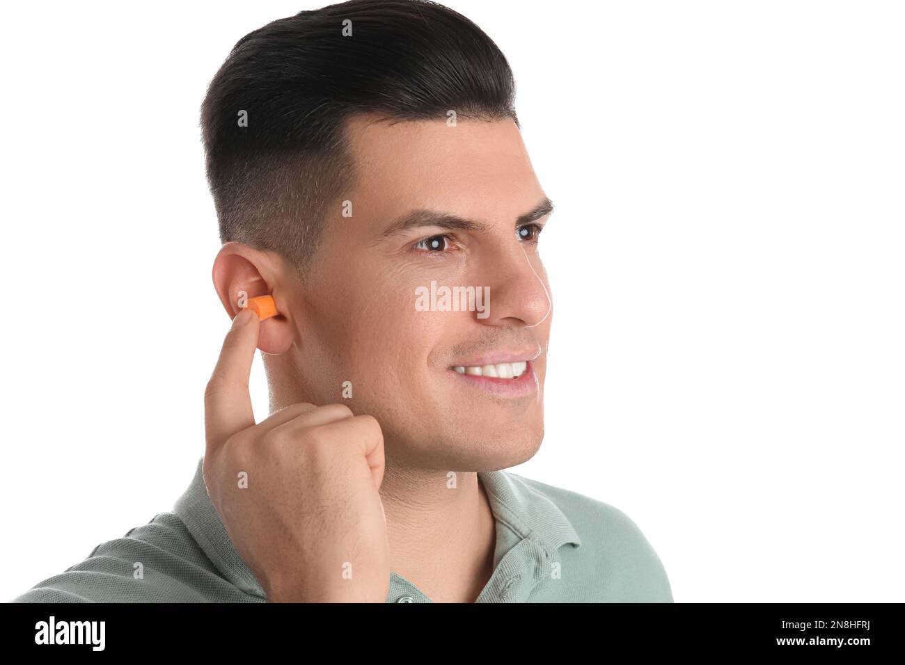 Man with earplug hi-res stock photography and images - Alamy