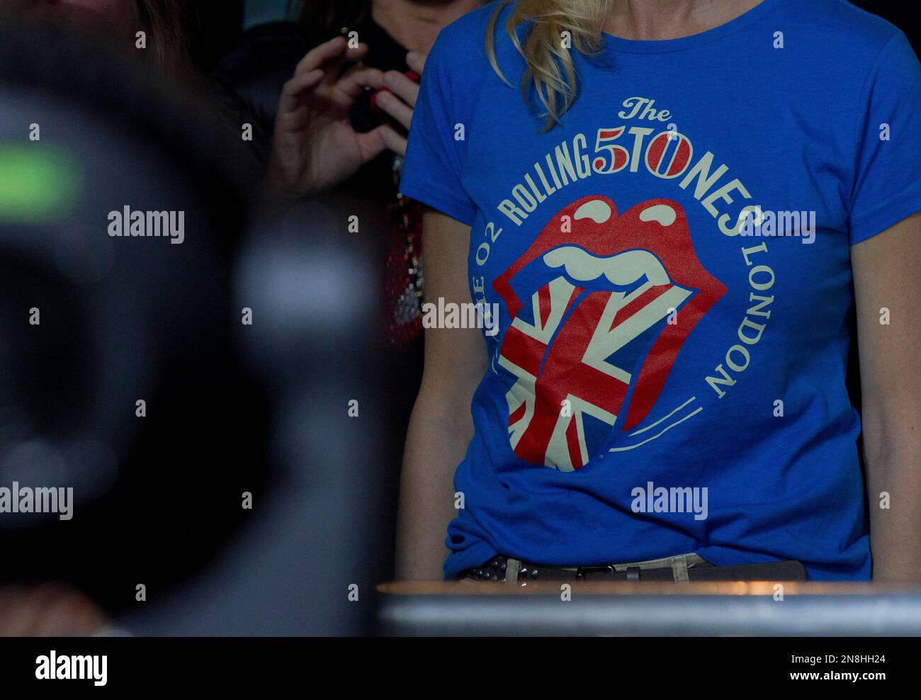Fans of The Rolling Stones watch them perform at the O2 arena in east ...