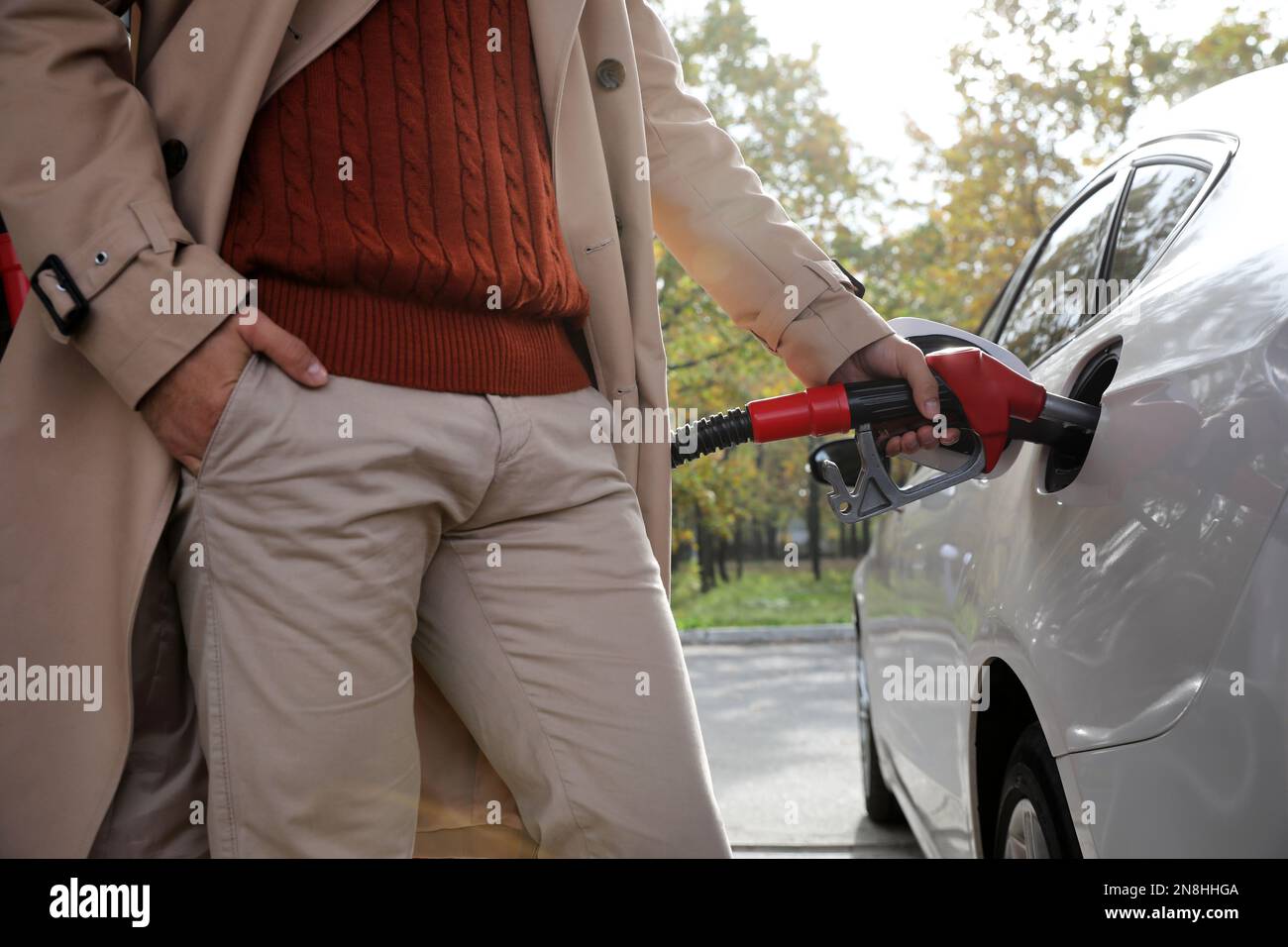 Man refueling car at self service gas station, closeup Stock Photo - Alamy