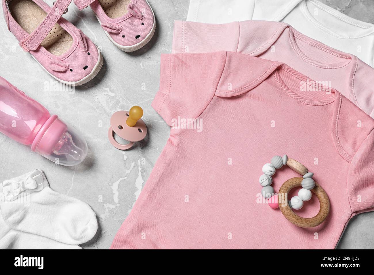 Flat lay composition with cute baby items on grey background Stock ...