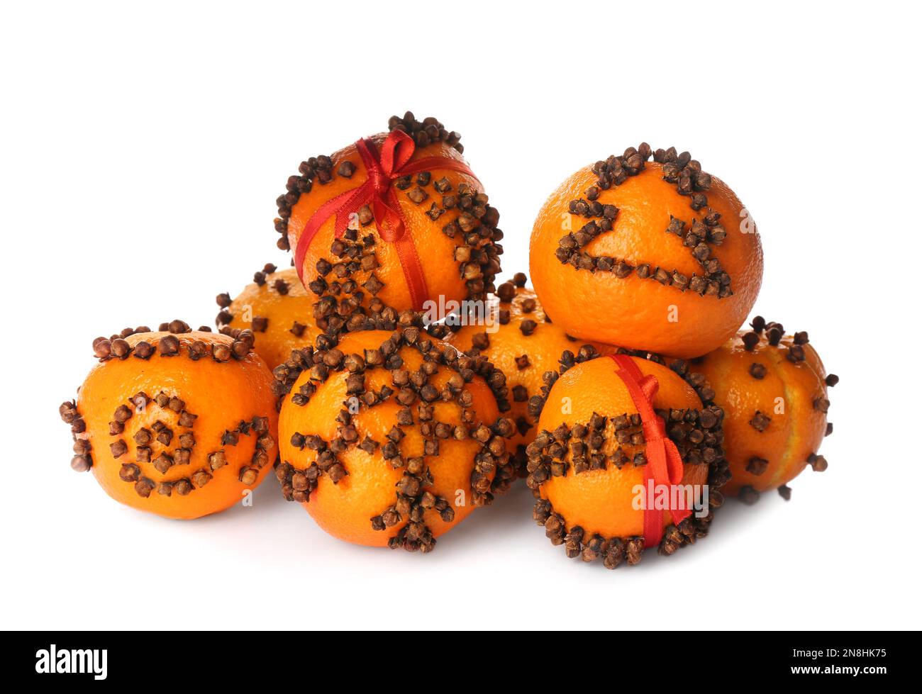 Pile of pomander balls made of fresh tangerines with cloves on white ...