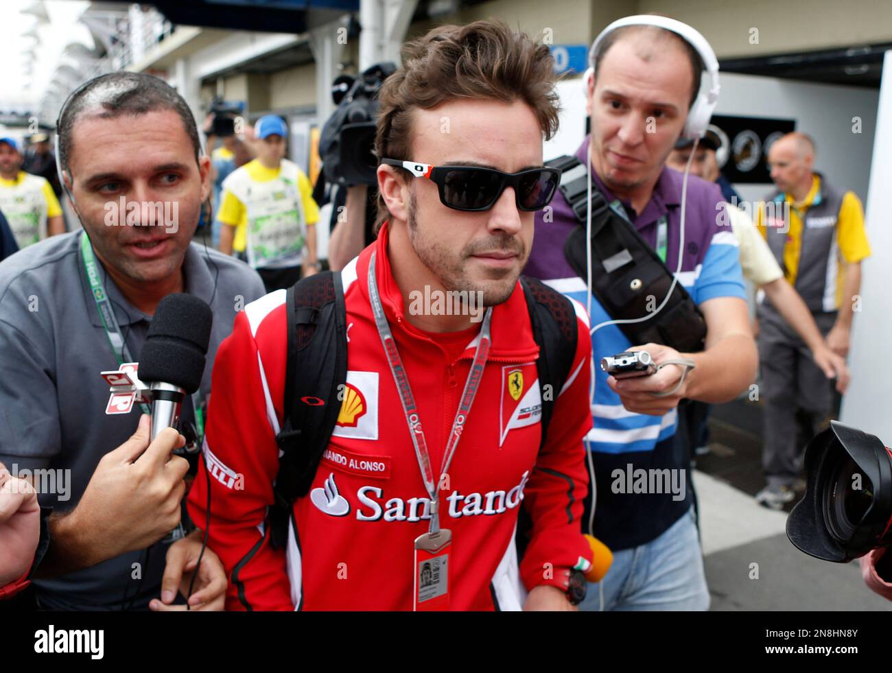 Ferrari driver Fernando Alonso, of Spain, arrives for the Formula One ...