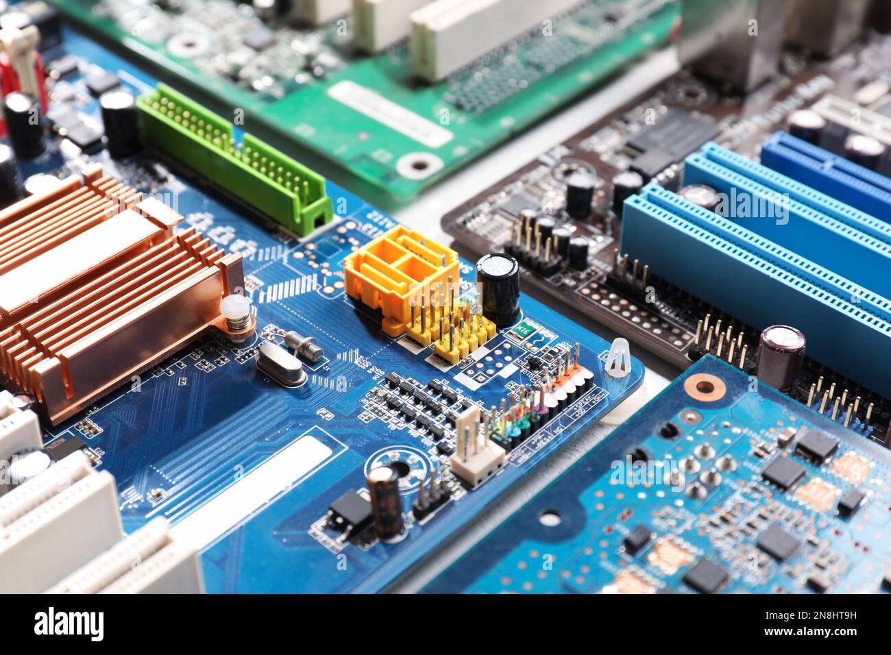 Computer motherboards on white table, closeup. Electronic device Stock ...