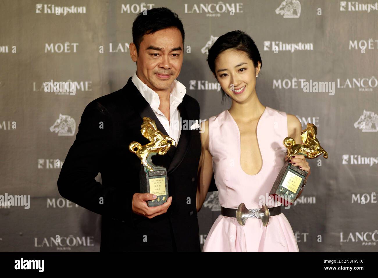 Taiwanese actress Gwei Lun-Mei and Hong Kong actor Lau ChingWan hold ...