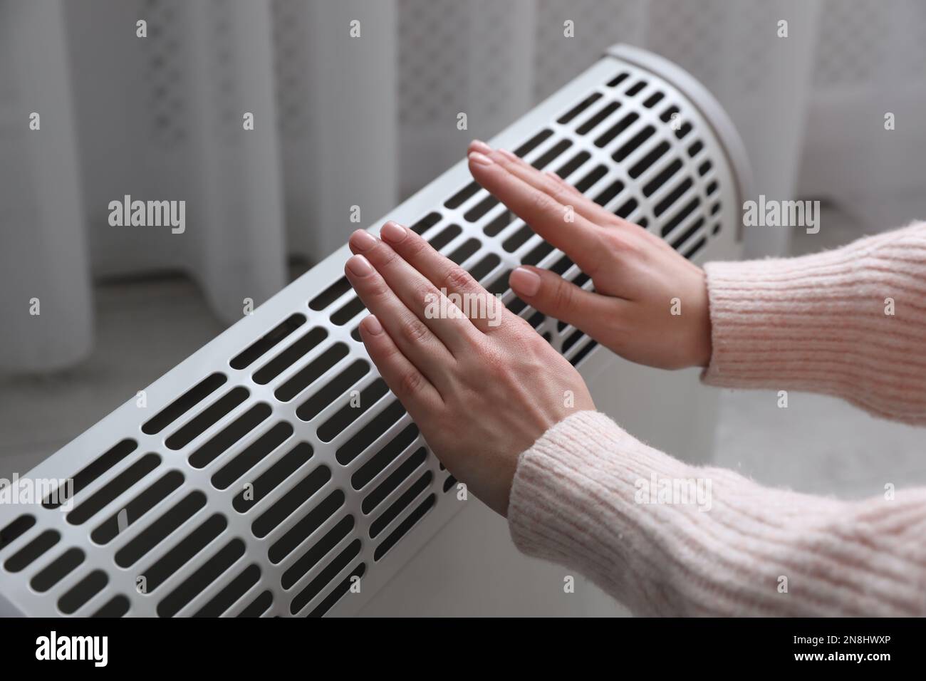 Hand warming cozy heater hi-res stock photography and images - Alamy