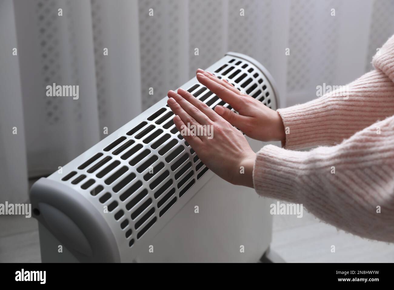 Hand warming cozy heater hi-res stock photography and images - Alamy