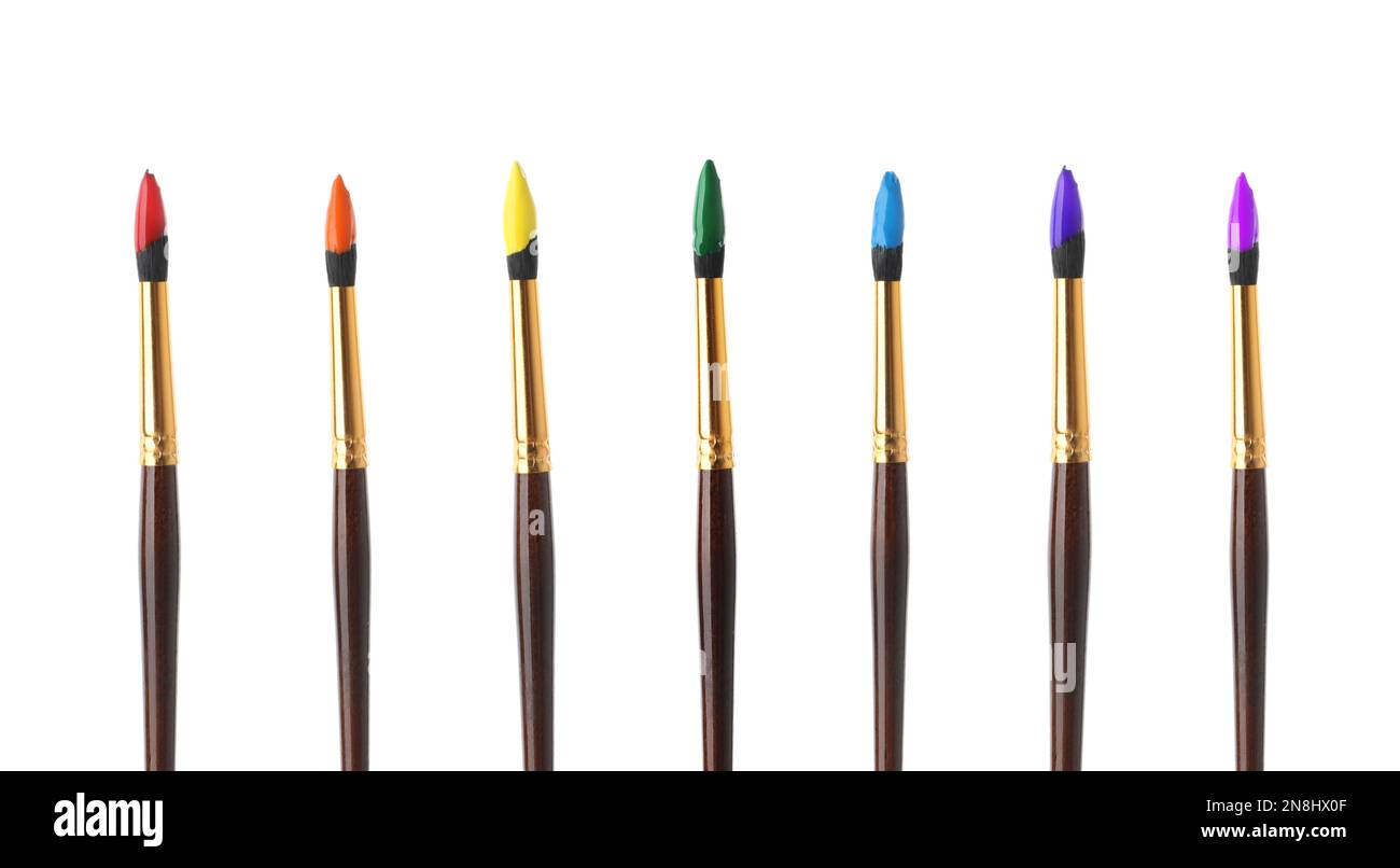 Collage of brushes with different bright paints on white background ...