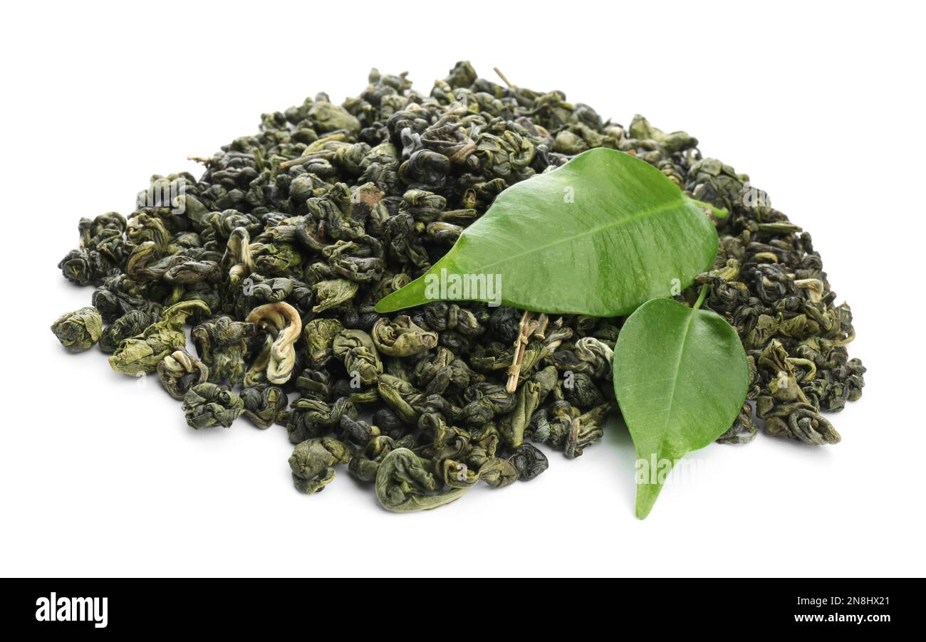 Pile of dried green tea leaves on white background Stock Photo - Alamy