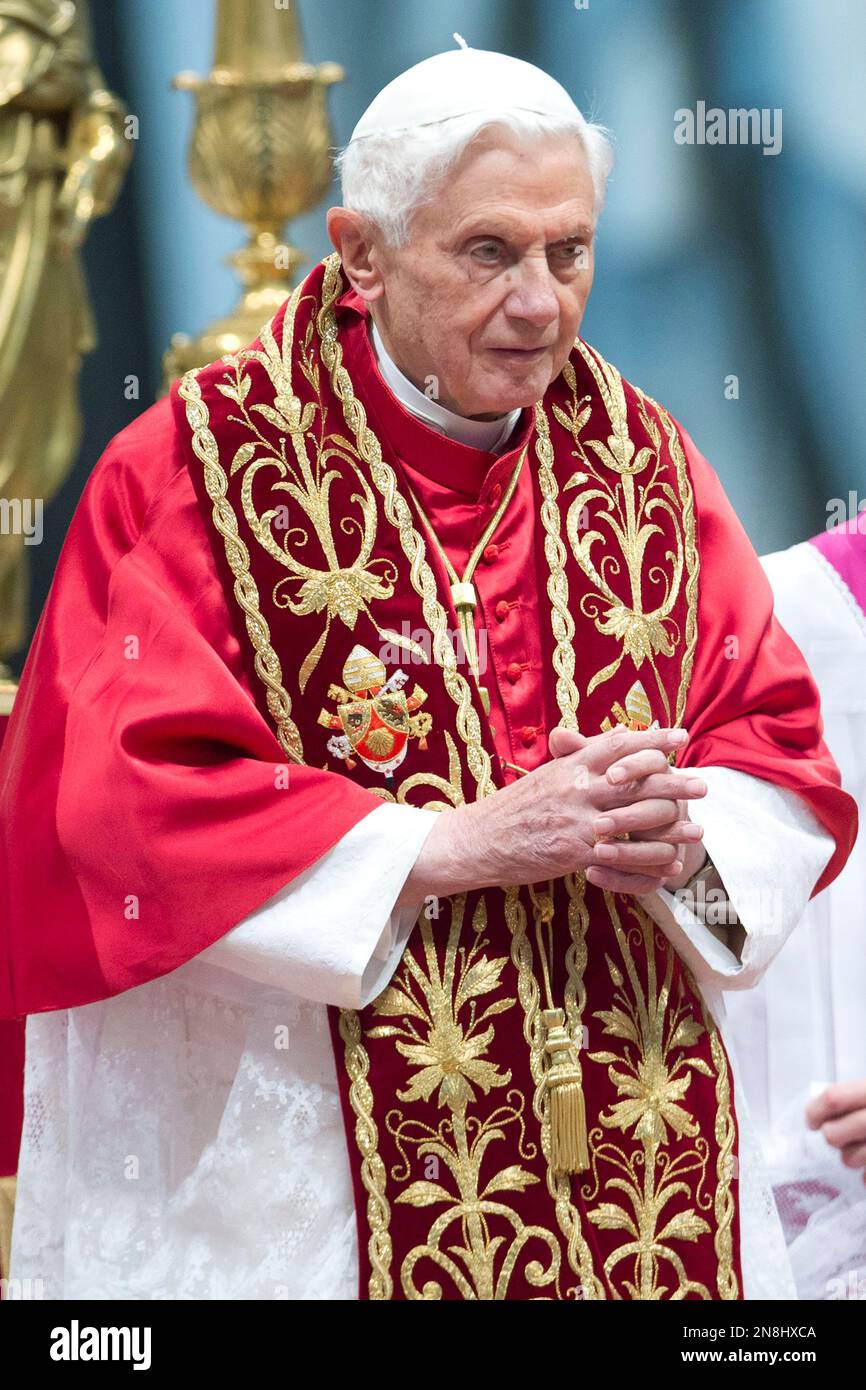 Pope Benedict XVI prays during a consistory in St. Peter's Basilica at ...