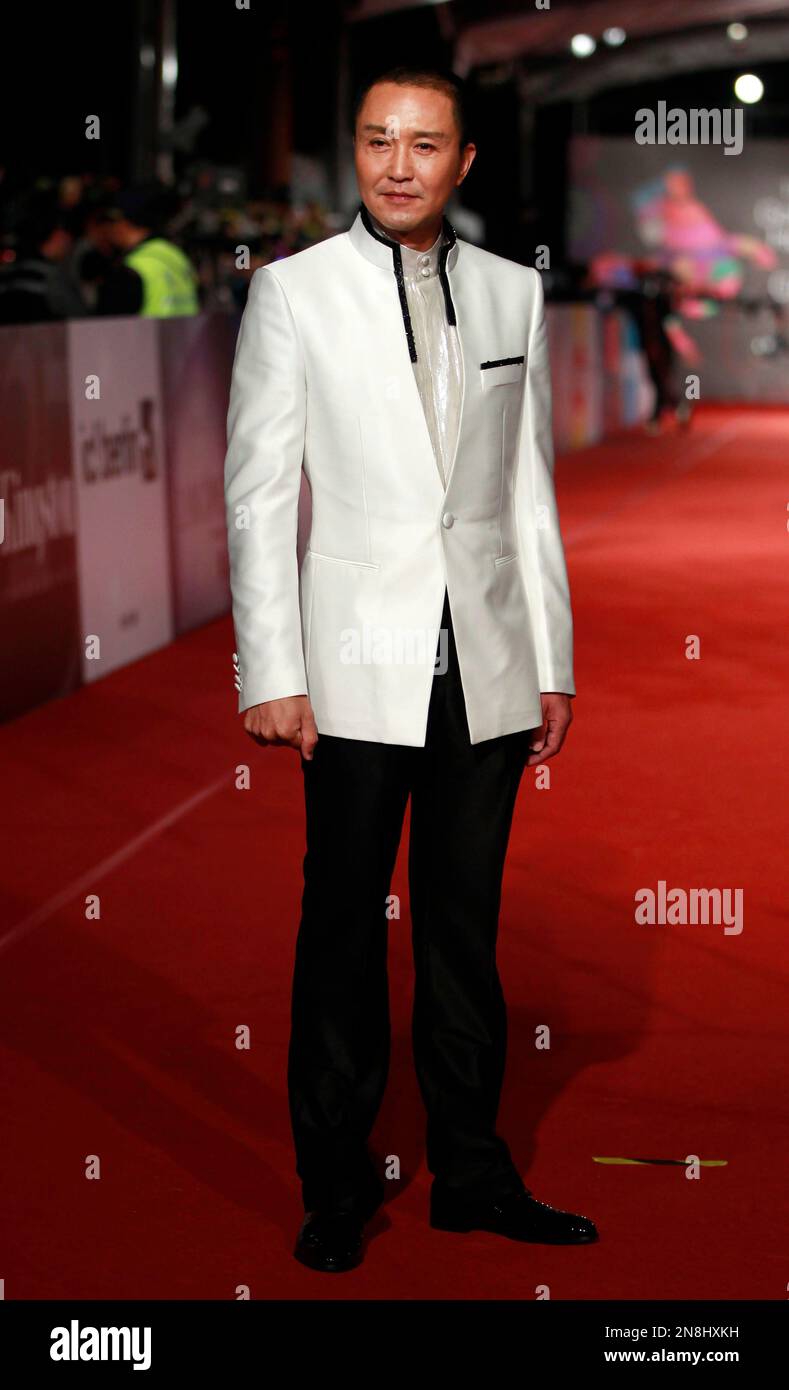 Hong Kong actor Wu Gang smiles as he arrives at the 49th Golden Horse ...
