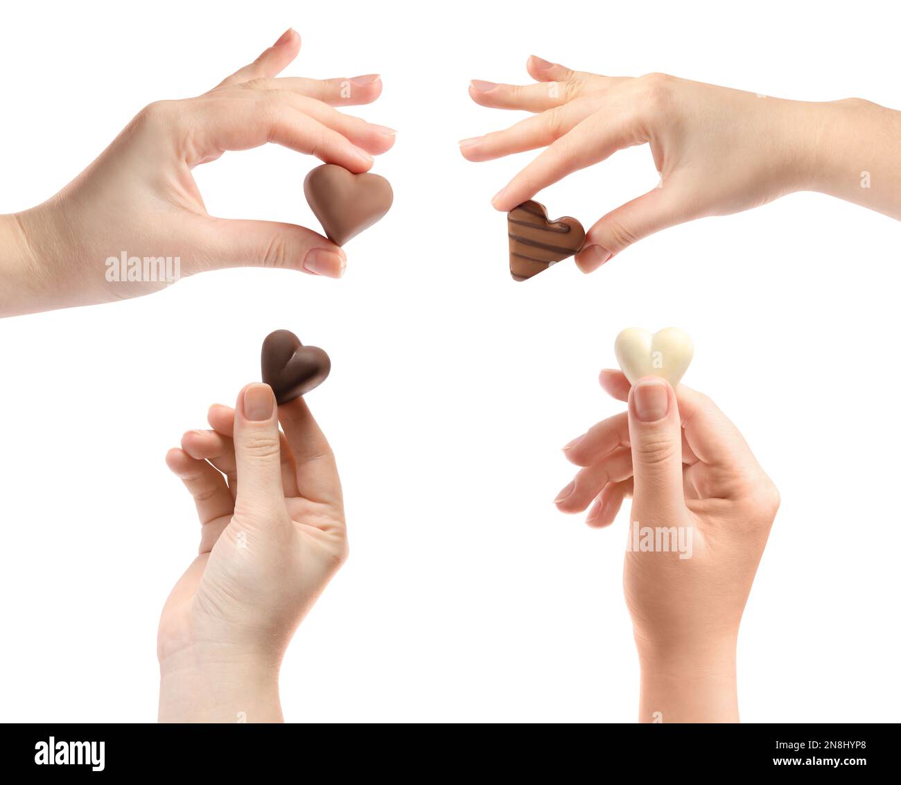 Closeup view of women with delicious heart shaped chocolate candies on ...