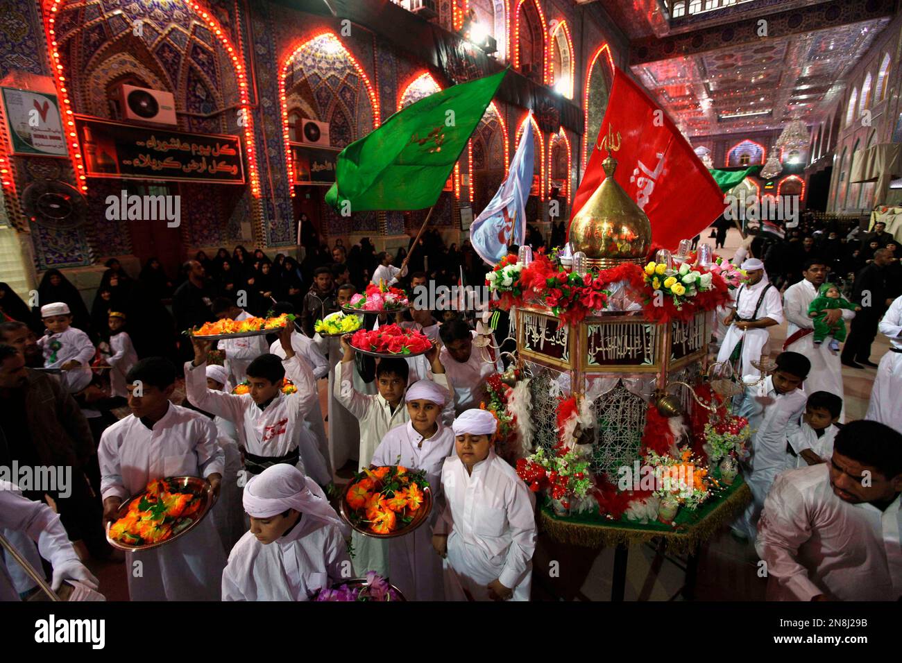 Shiite Muslim worshippers gather inside the holy shrine of Imam Hussein ...