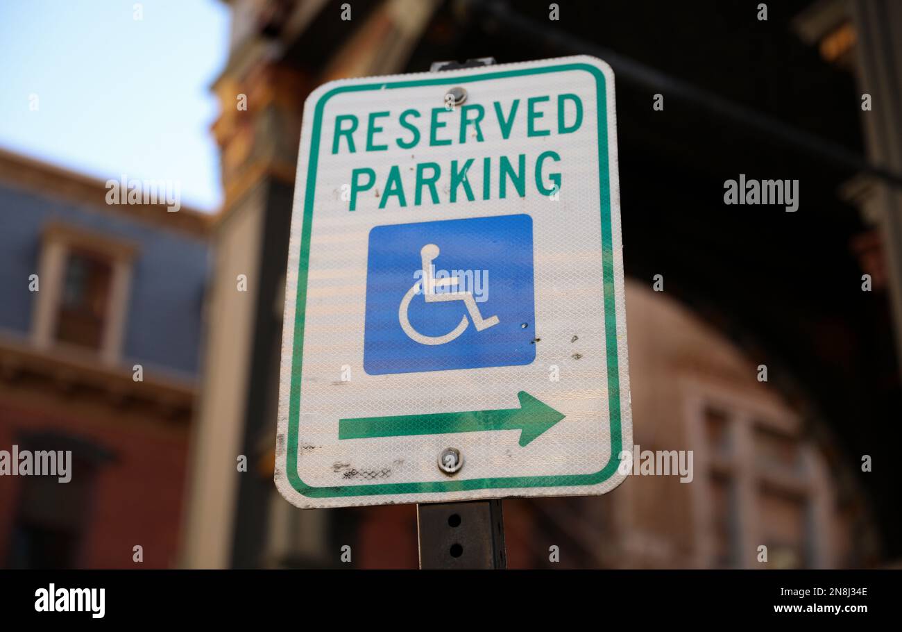 Handicap sign parking lot accessible symbol Stock Photo - Alamy