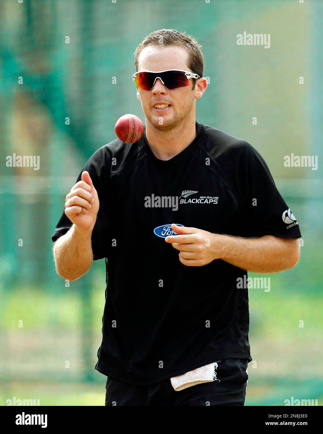 New Zealand's Todd Astle tosses a ball during a cricket practice ...
