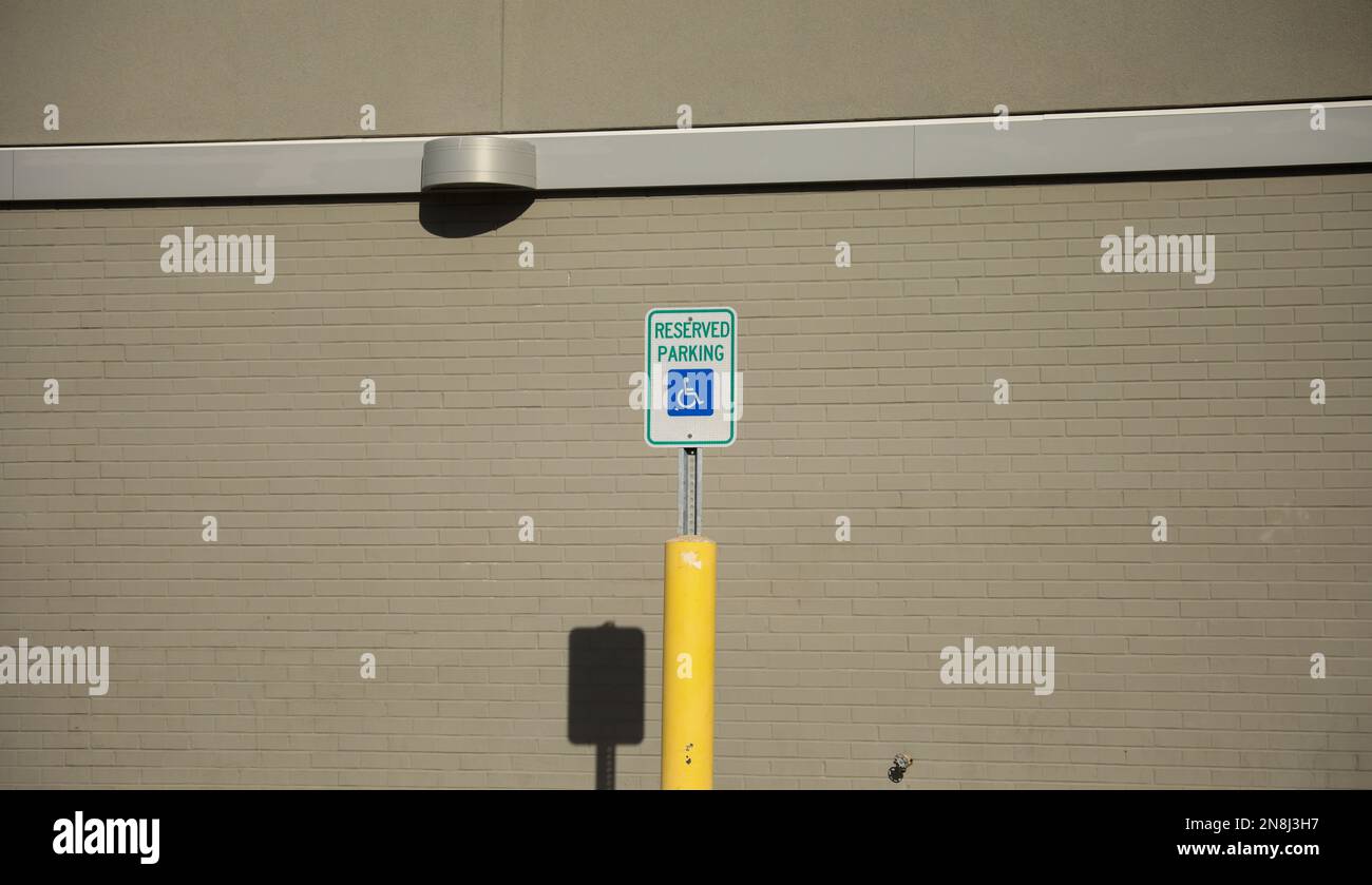 Handicap sign parking lot accessible symbol Stock Photo - Alamy
