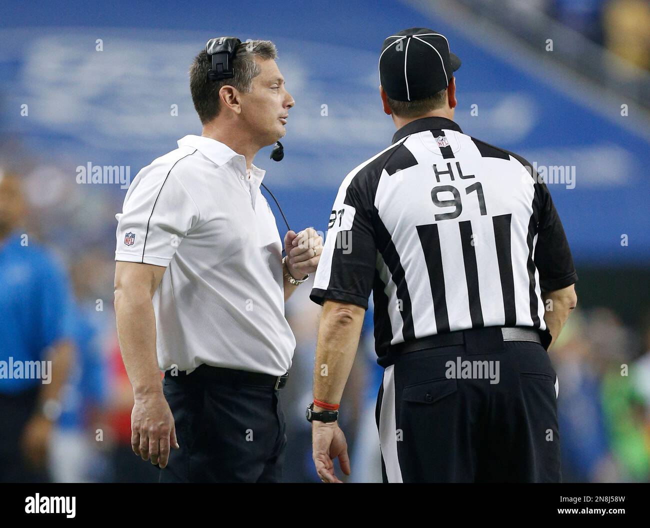 Detroit Lions head coach Jim Schwartz talks with head linesman Jerry ...
