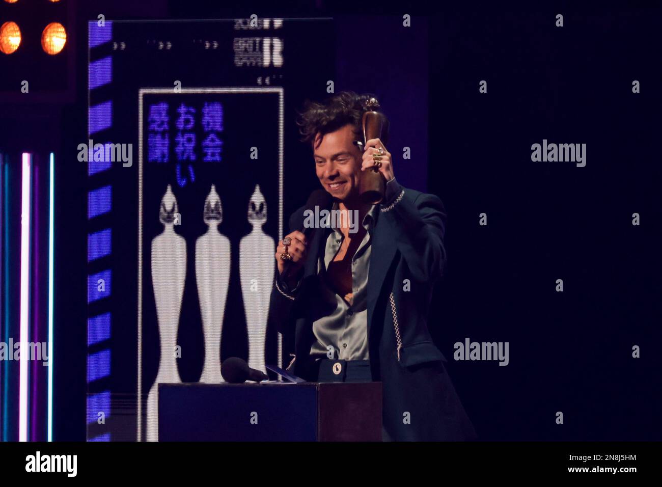 Harry Styles on stage accepting the award for Album of the Year at the ...