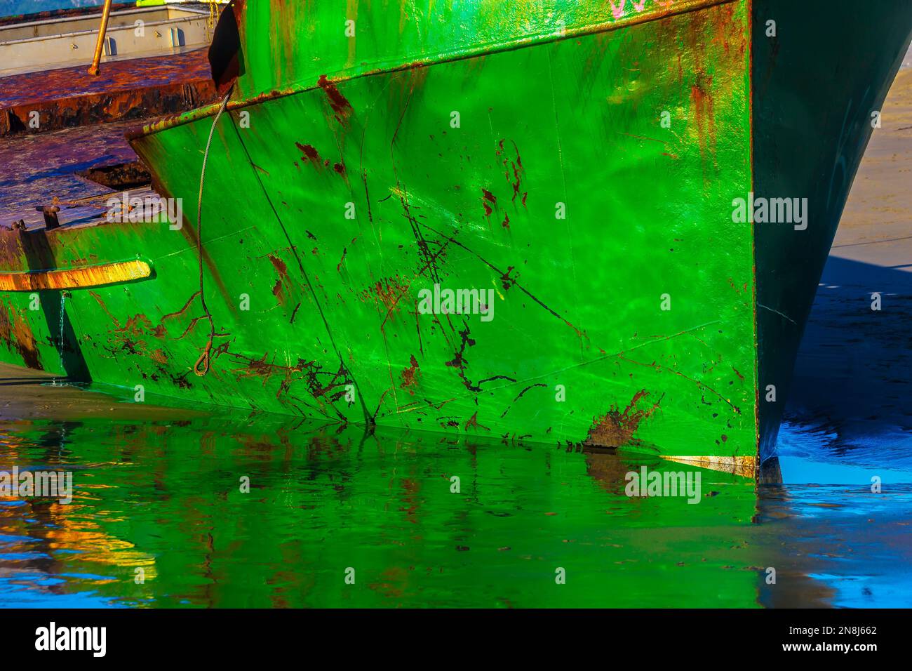 Worn Beached Green Fishing Boat Stock Photo - Alamy
