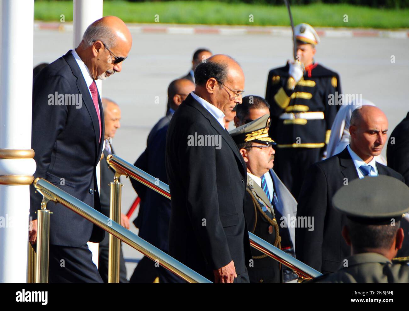Tunisia's President Moncef Marzouki, right, greets, Mohamed Yousef el ...