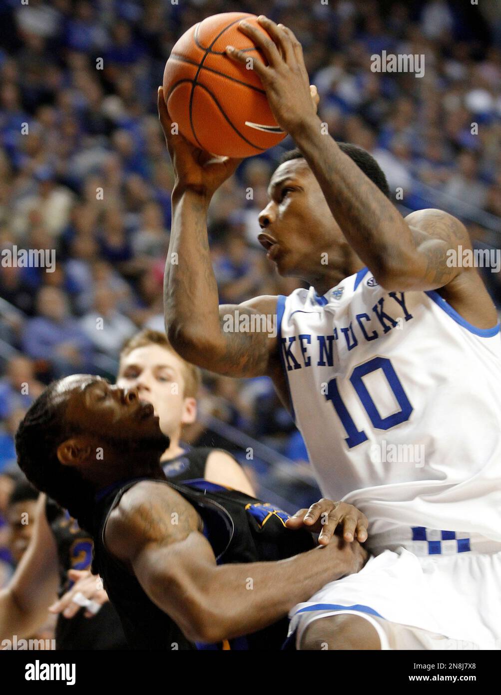 Kentucky's Archie Goodwin (10) shoots under pressure from Morehead ...