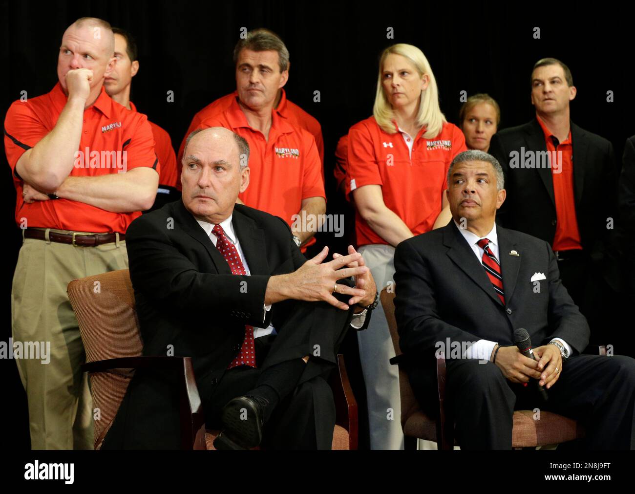 Big Ten commissioner James Delany, left, listens to a question at a ...