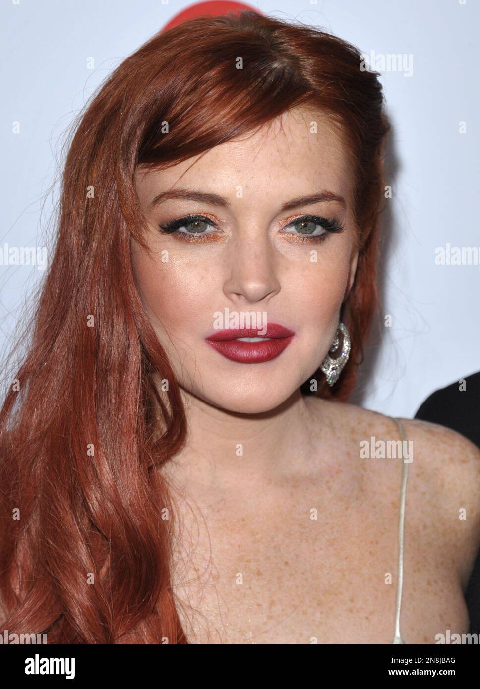 Lindsay Lohan attends a dinner celebrating the premiere of "Liz & Dick ...