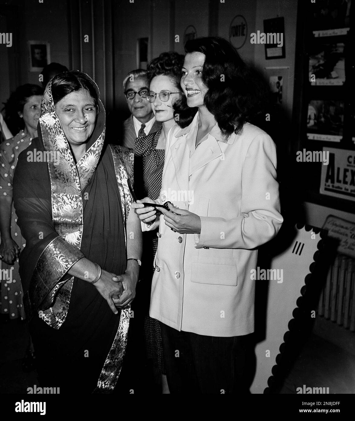 Actress Rita Hayworth, right, talks with Madame Wazir Cassamally Munjee ...