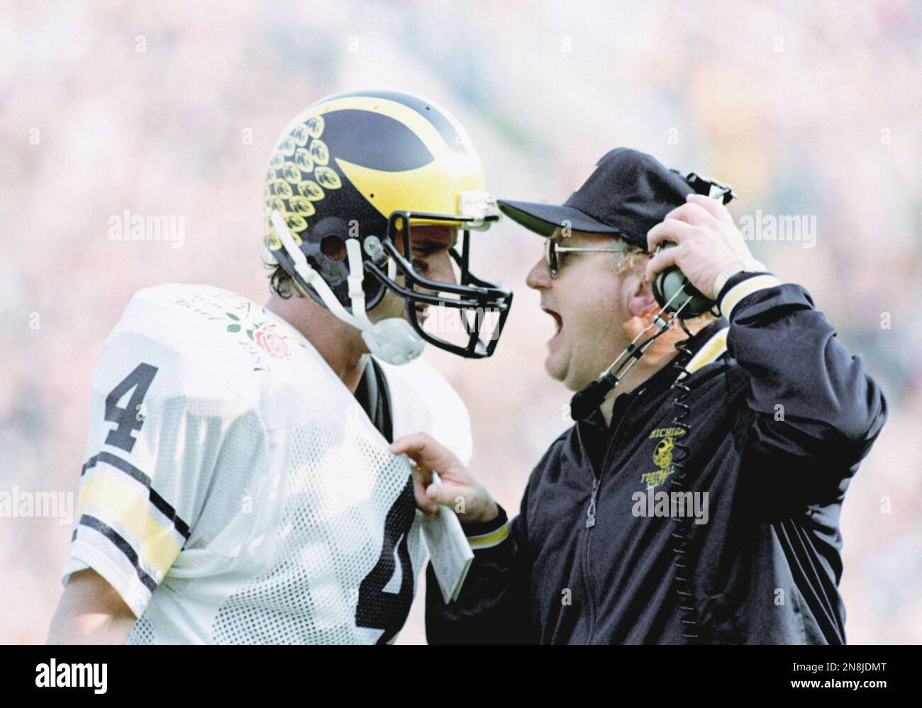 Michigan head coach Bo Schembechler yells at quarterback Jim Harbaugh ...