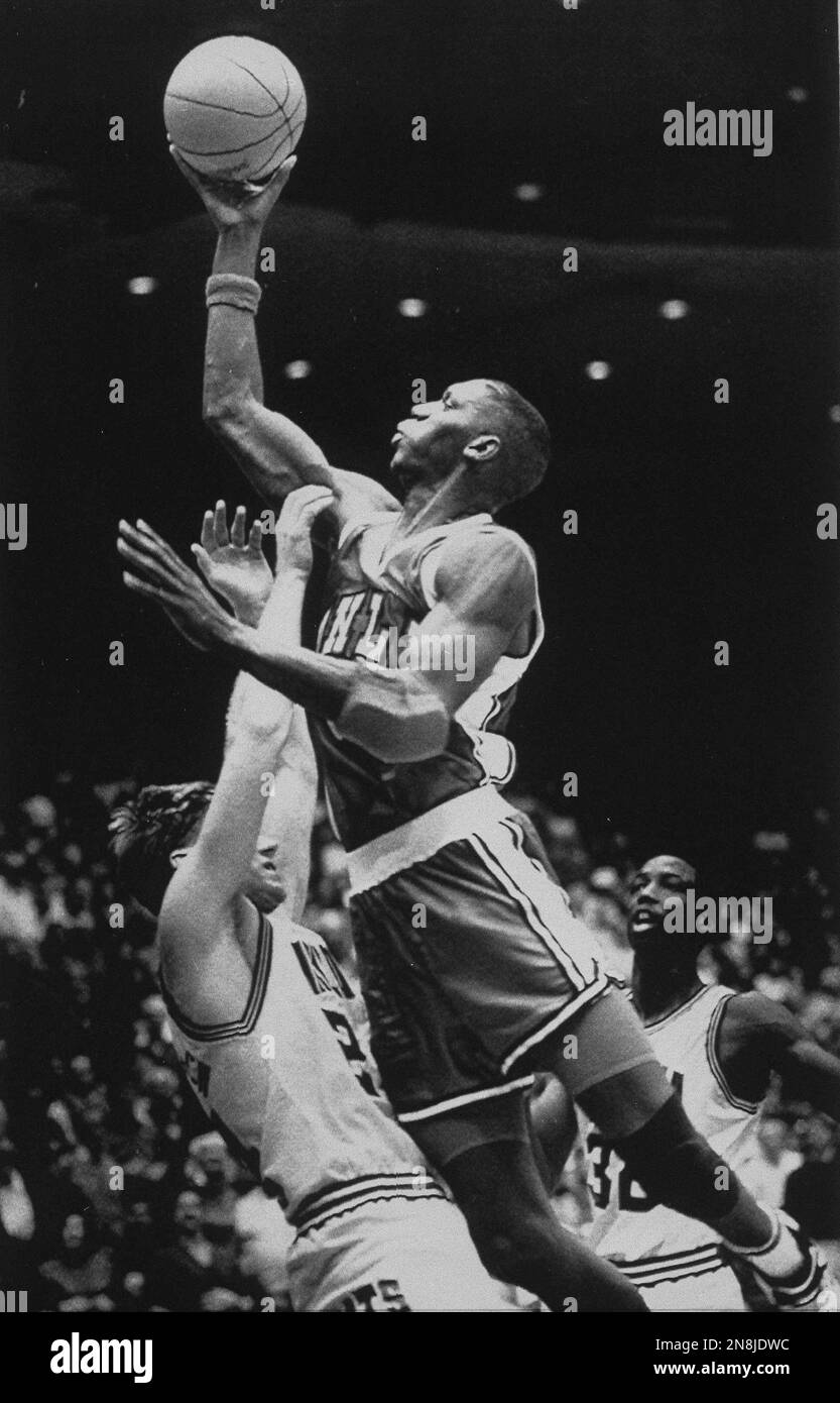 UNLV center David Butler drives over University of Arizona guard Matt ...
