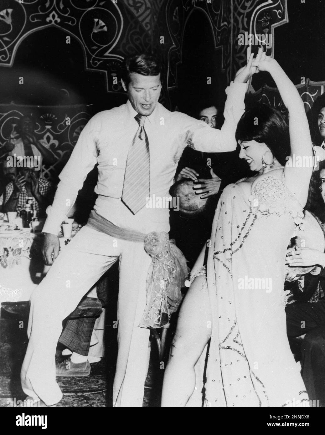 Roger Moore, star of the latest James Bond film "The Spy Who Loved Me ...