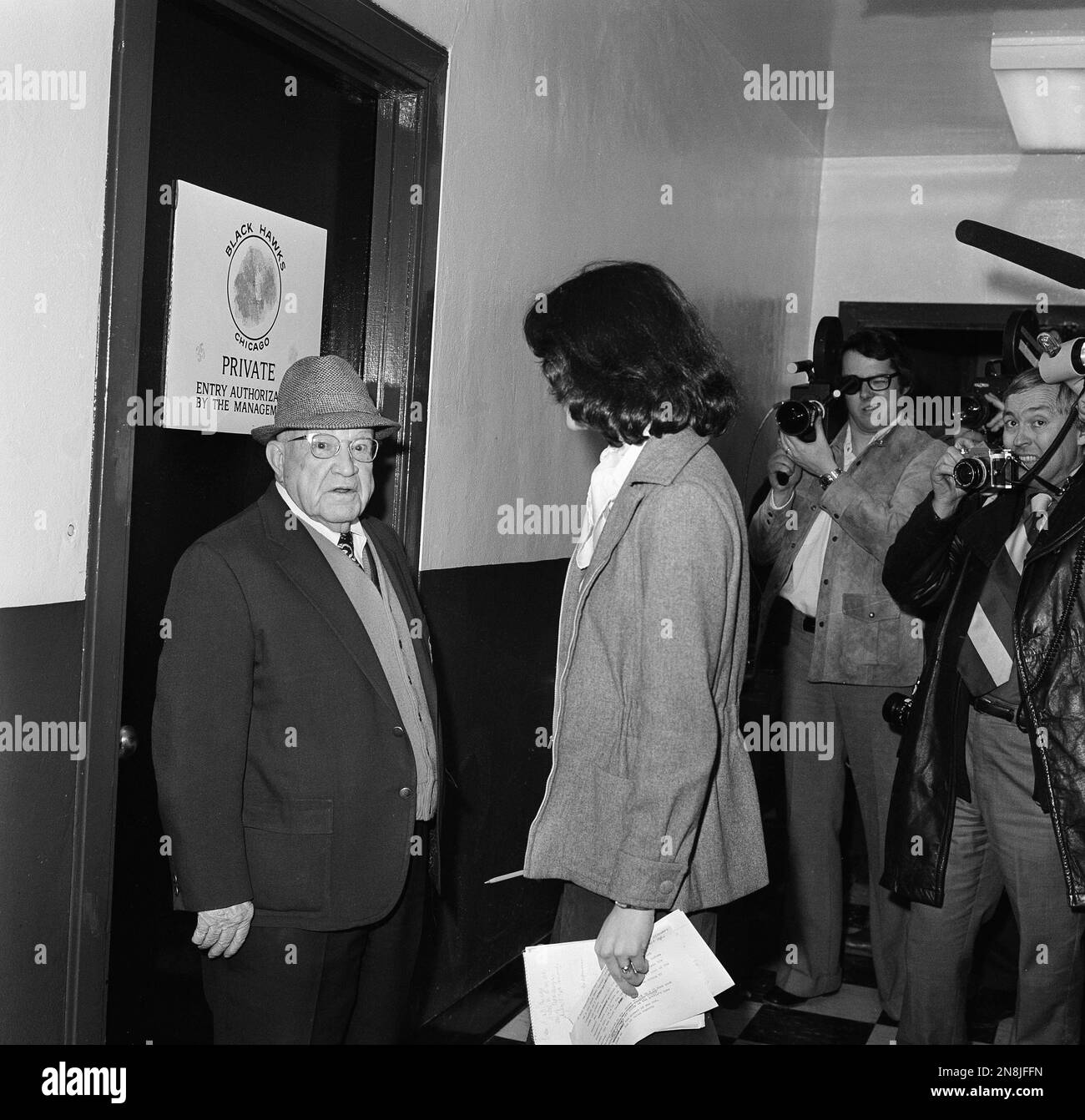 Robin Herman, sports writer for the New York Times, is confronted by ...