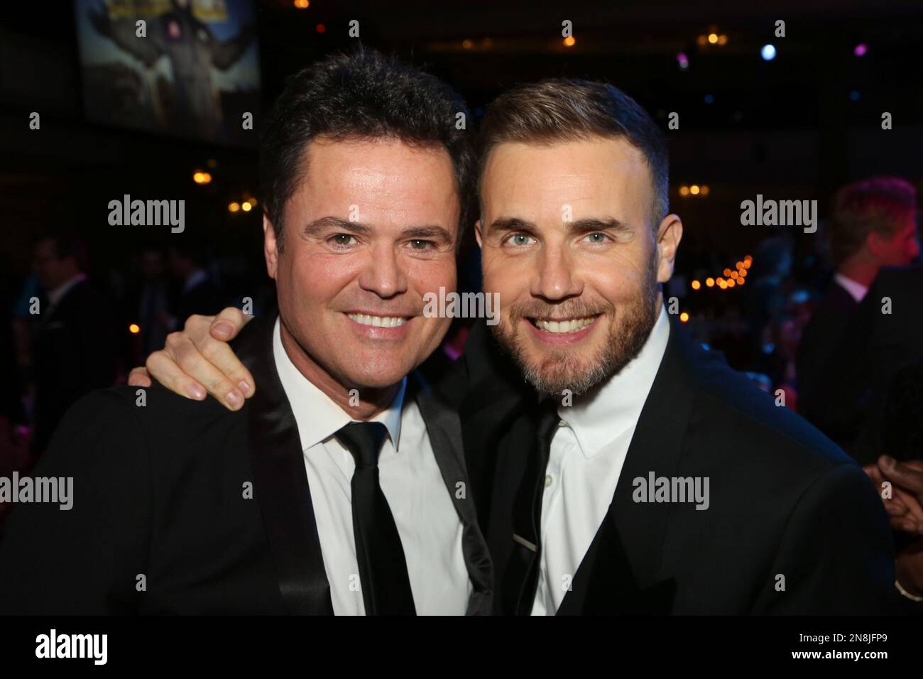 FILE - Donny Osmond, left, and Gary Barlow seen at the 2012 Music Industry Trusts Award ceremony ...