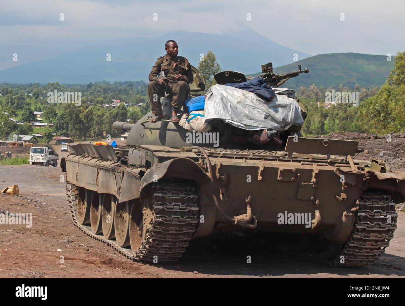 A Congolese army tank overlooking Munigi and the road to Rutshuru where ...