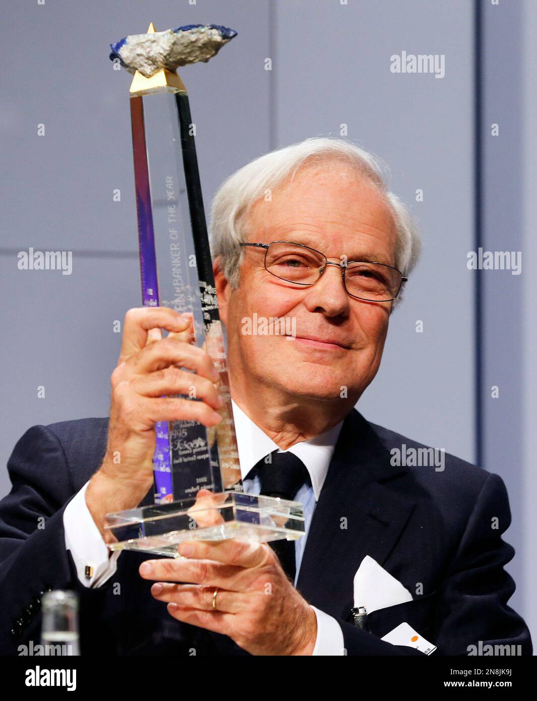 Baron David de Rothschild, Chairman of Rothschild Bank, holds the award ...