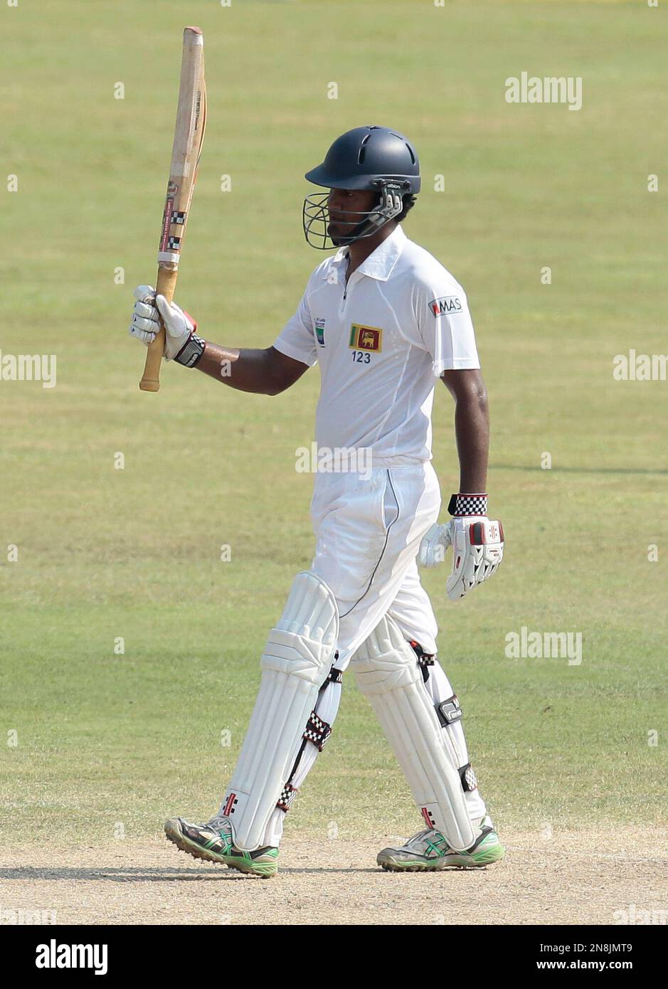 Sri Lanka's Dimuth Karunaratne acknowledges the crowd after scoring a ...