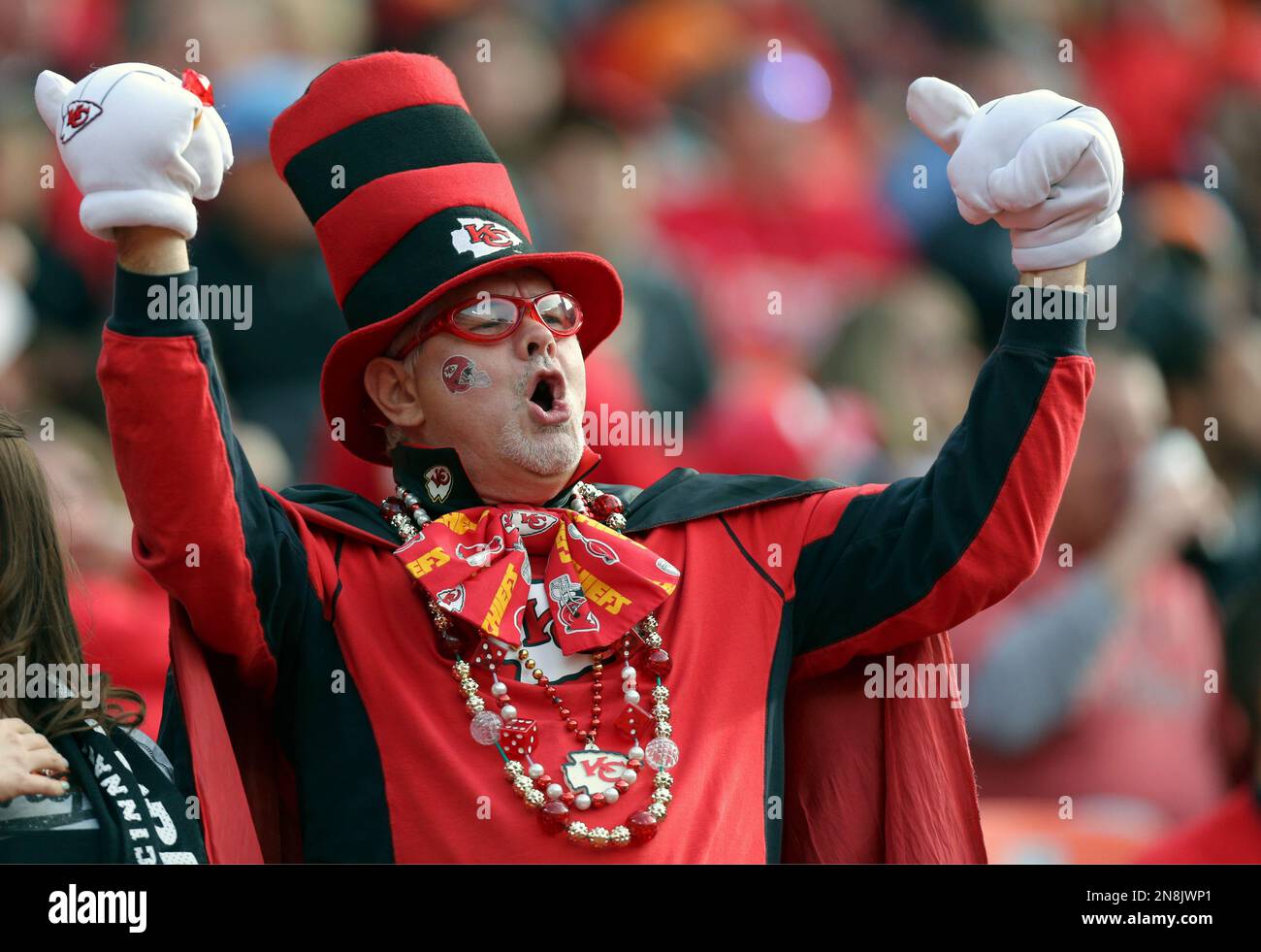 A Kansas City Chiefs fan cheers during an NFL football game against the ...