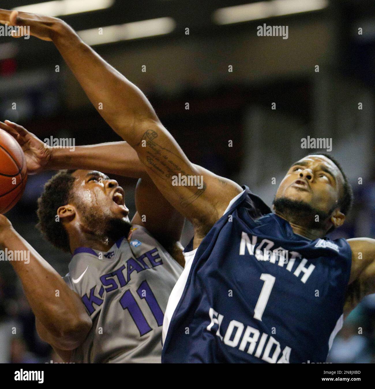 Kansas State forward Nino Williams (11) is fouled by North Florida ...