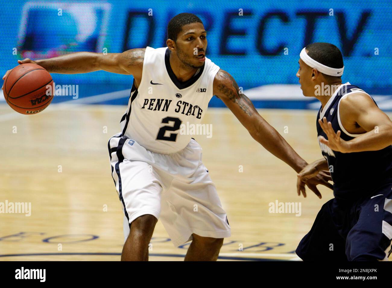 Penn State’s DJ Newbill, left, drives against Akron’s Alex Abreu during ...