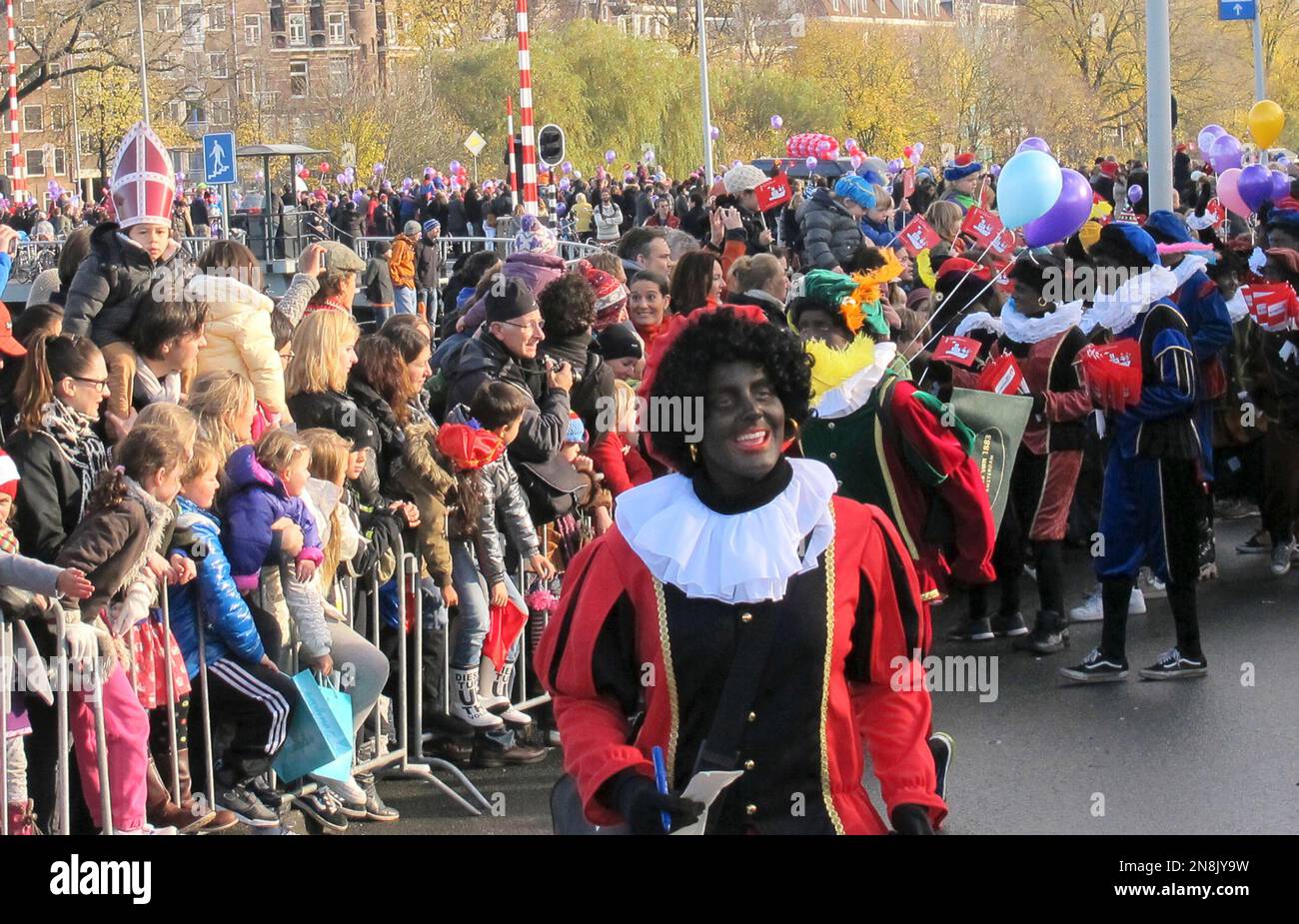 Crowds of people await the arrival of St. Nicholas, or Sinterklaas, on ...