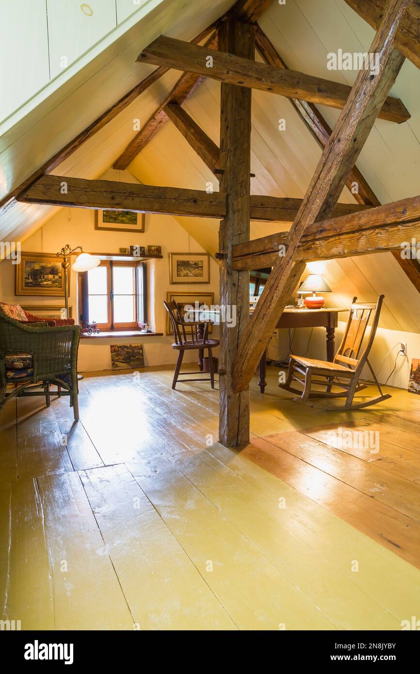 Wooden framework in attic home office room with antique wooden chairs ...