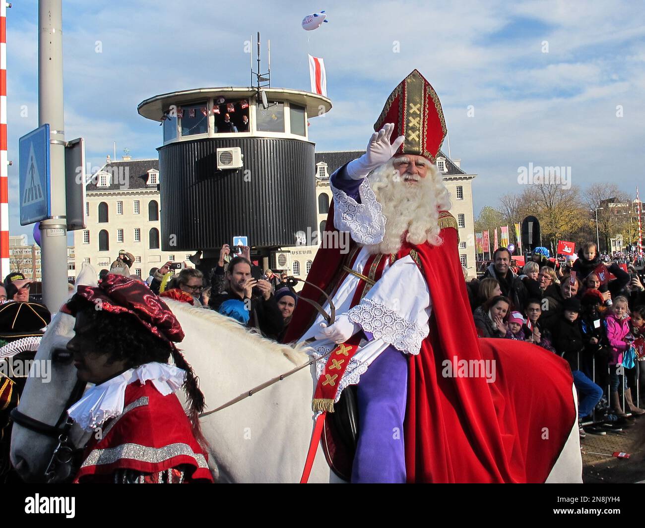 St. Nicholas, or Sinterklaas, and his helper named "Zwarte Piet" or ...
