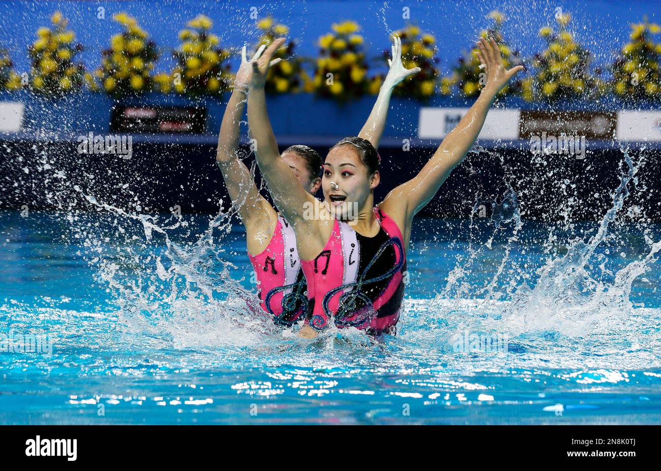 The North Korean team performs during the duets free routine final ...