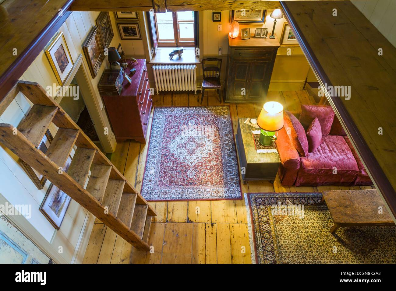 Top view of upstairs family room with wooden Miller's stairs, crimson ...
