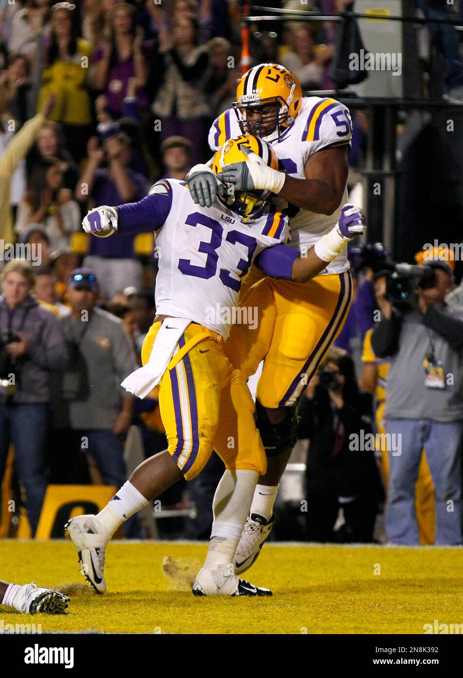 LSU running back Jeremy Hill (33) celebrates his rushing touchdown with ...
