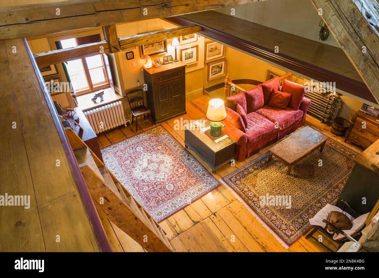 Top view of upstairs family room with wooden Miller's stairs, crimson ...